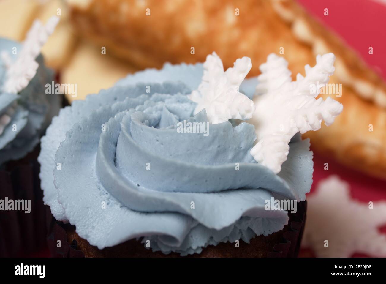 Muffin with cream cheese cream. Decorated with a marshmallow snowflake ...