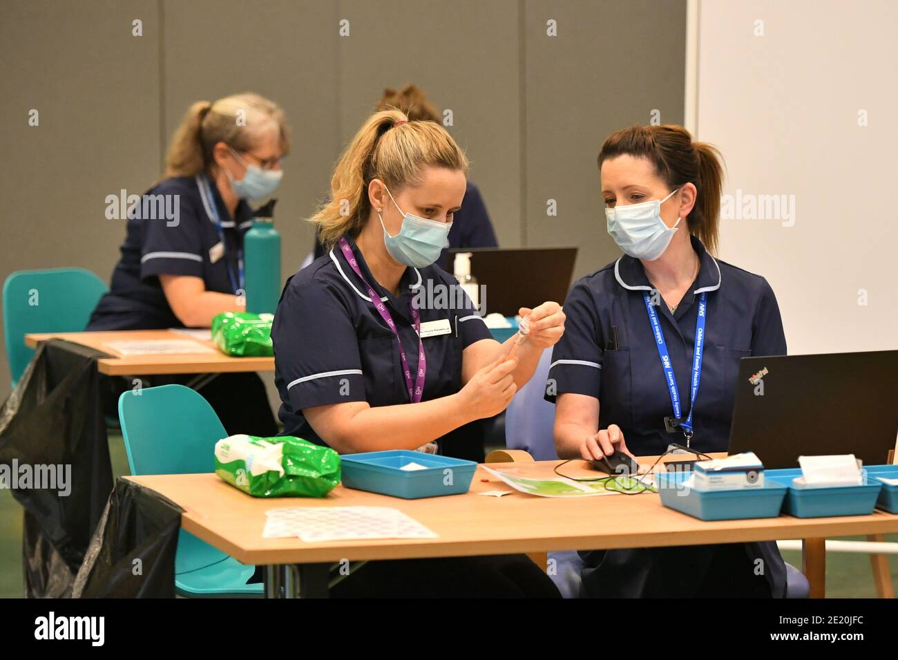 Staff make preparations ahead of the opening of the NHS mass ...
