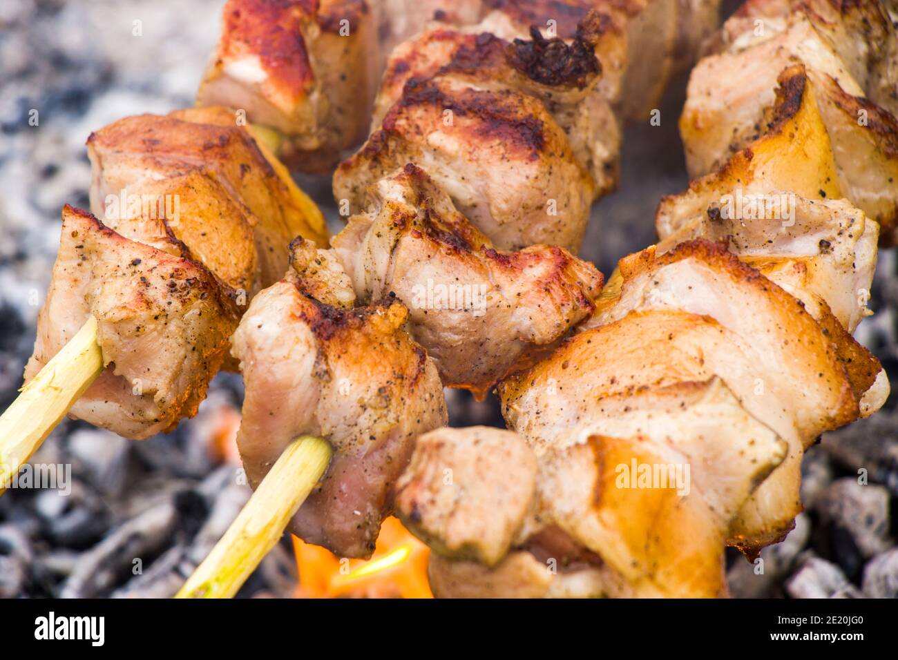 Georgian traditional dish, Mtsvadi on the fire, raw meal on the grill ...