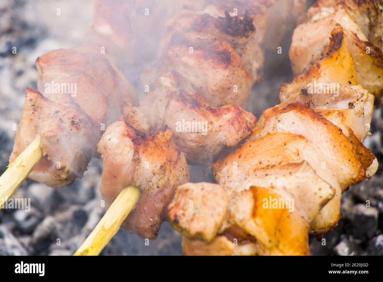 Georgian traditional dish, Mtsvadi on the fire, raw meal on the grill ...