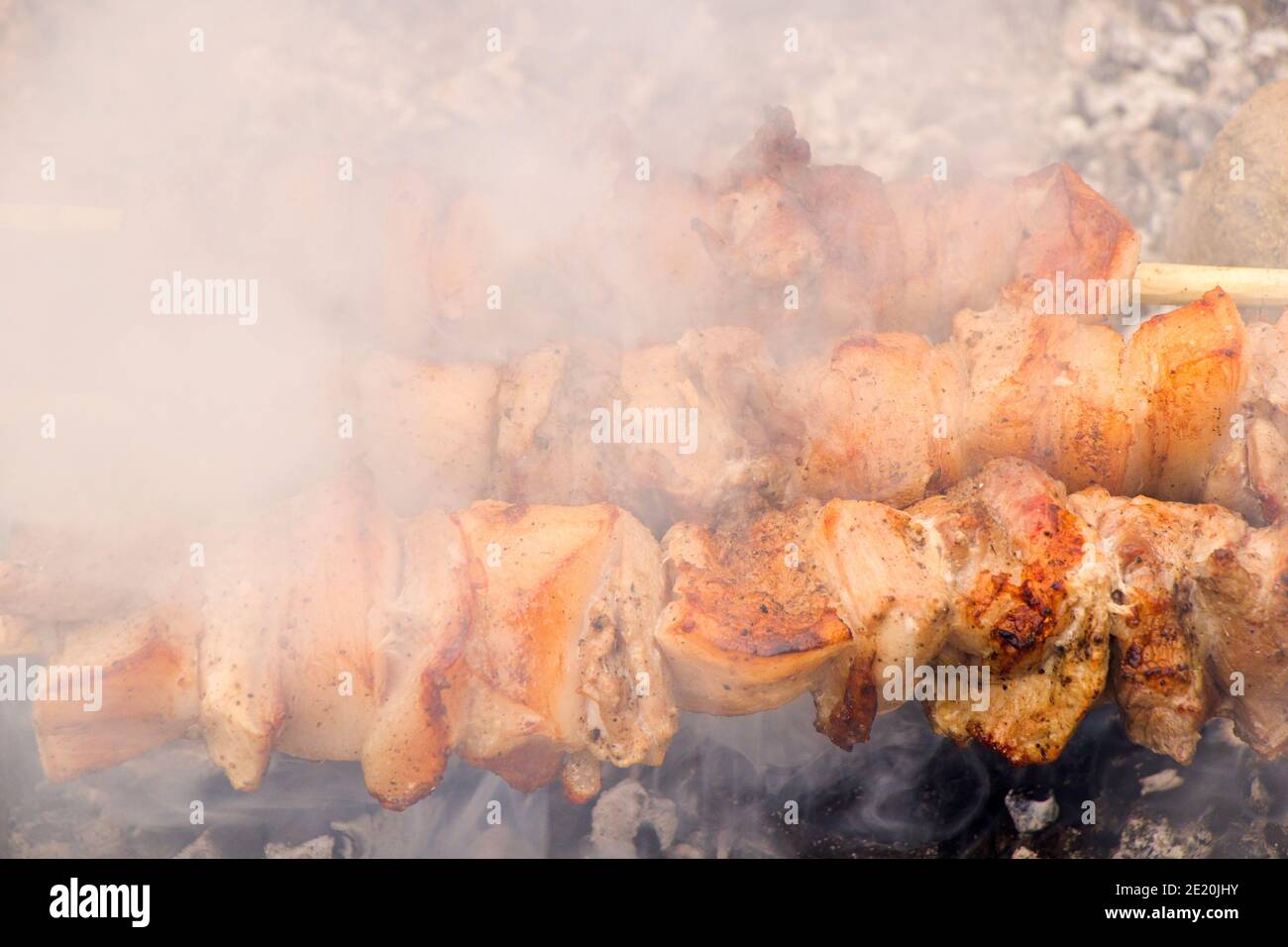Georgian traditional dish, Mtsvadi on the fire, raw meal on the grill ...