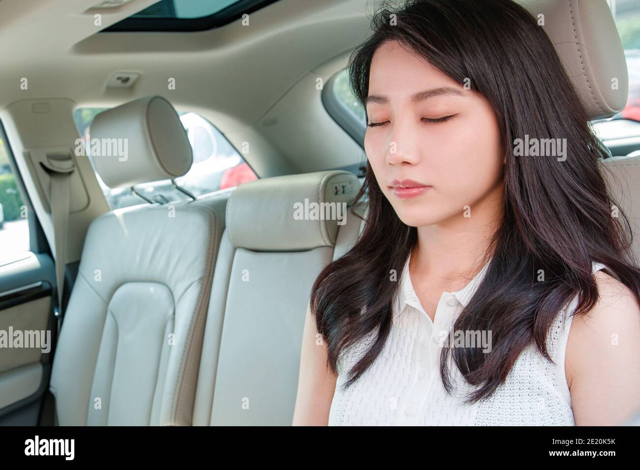 Inside the car tired business women Stock Photo - Alamy