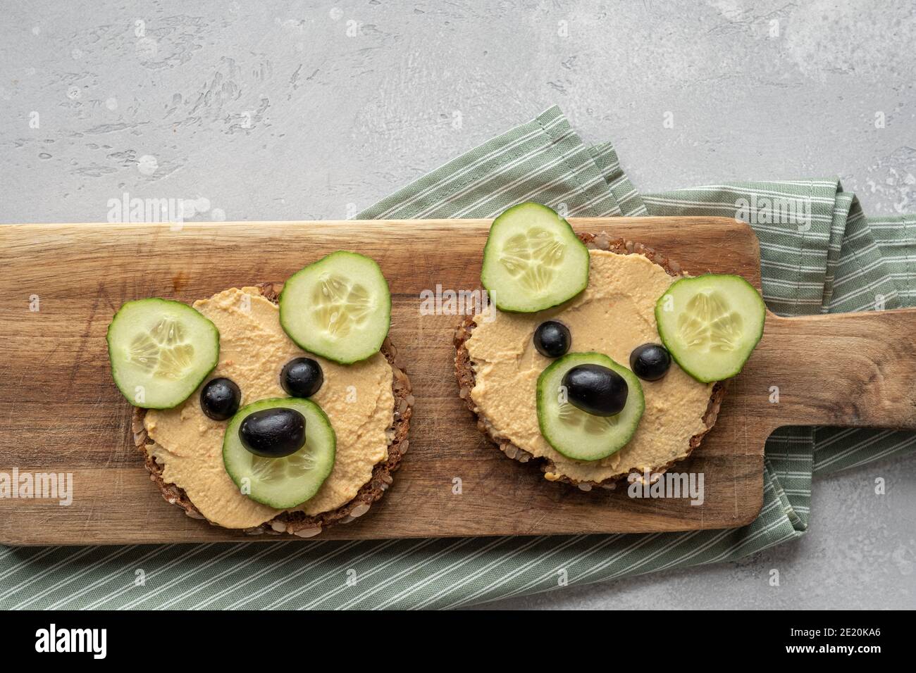 Funny bear toast with cucumber and hummus toasts Stock Photo - Alamy