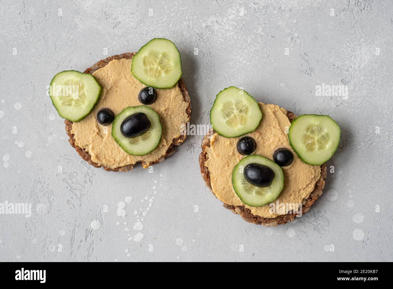 Funny bear toast with cucumber and hummus toasts Stock Photo - Alamy