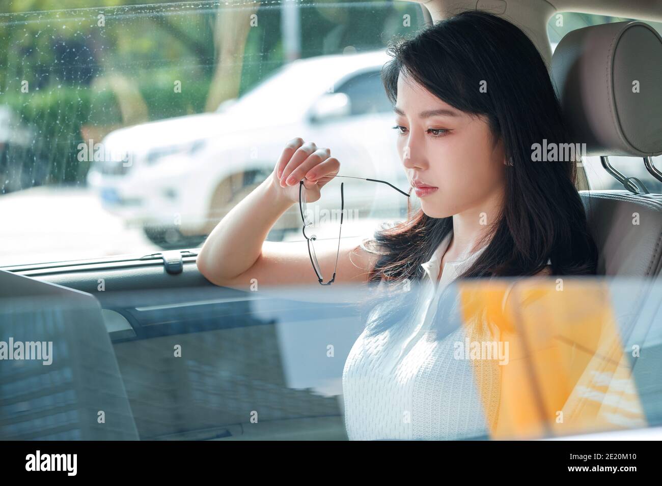 Business women in the cars in use the computer Stock Photo - Alamy