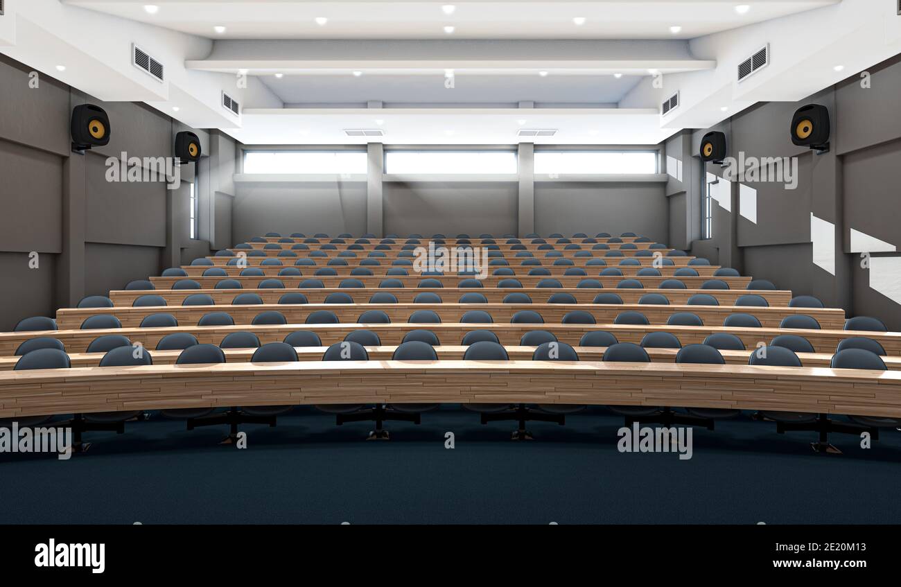 An interior of an empty lecture hall auditorium with rows of curved ...