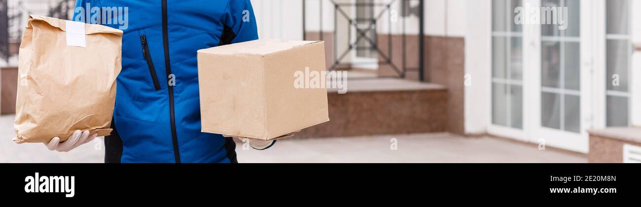Diverse of paper containers for takeaway food. Delivery man is carrying ...