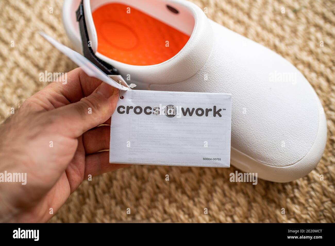 Paris, France - Dec 13, 2020: POV male hand holding paper advertising ...