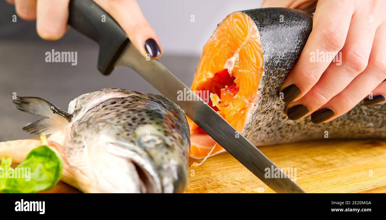 Cutting salmon fresh fish for dinner. diy cooking at home Stock Photo ...