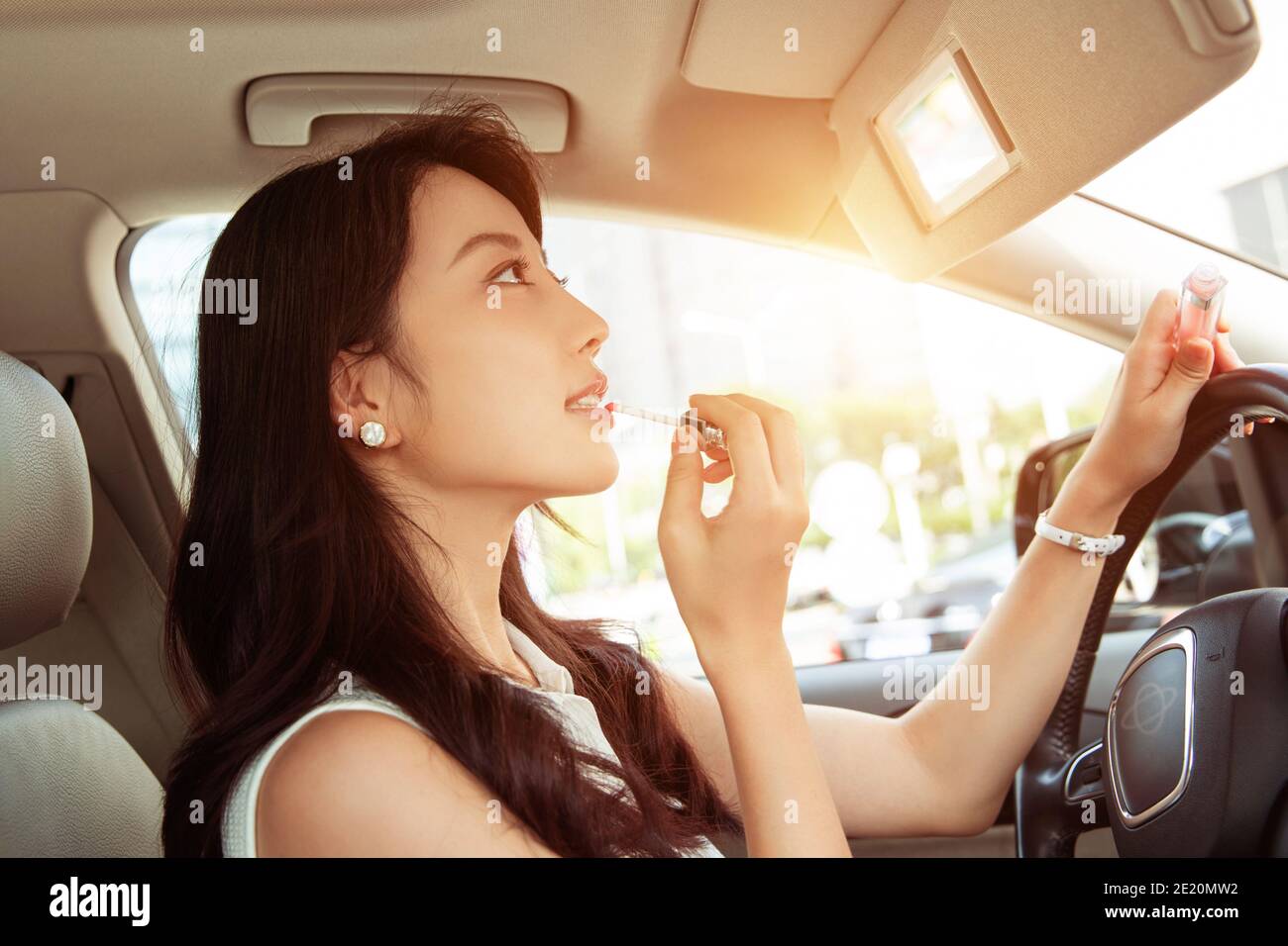 Young women makeup in the car Stock Photo - Alamy
