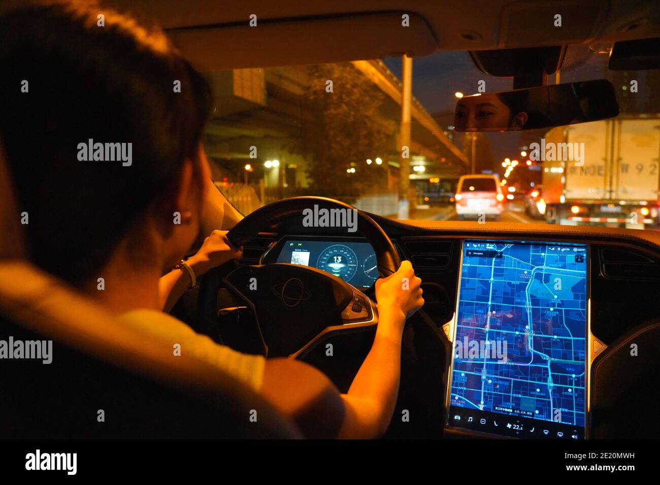 Driving at night young woman Stock Photo - Alamy