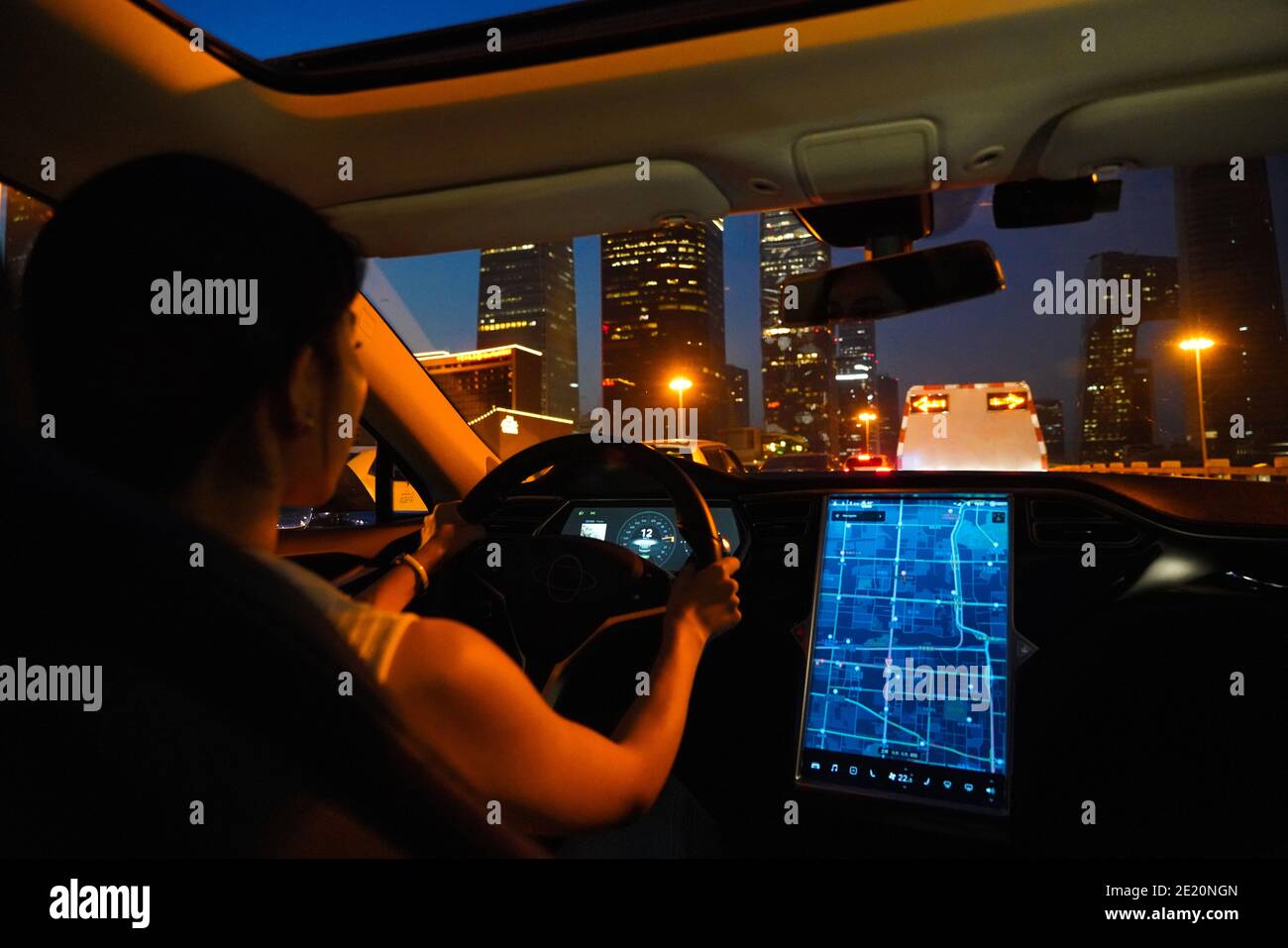 Driving at night young woman Stock Photo - Alamy