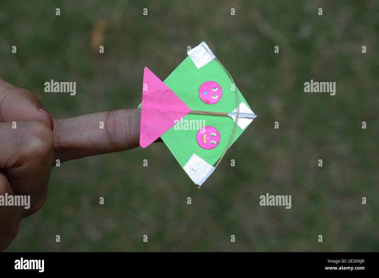 Small miniature cute kite on index finger, size of a finger tiny kite ...