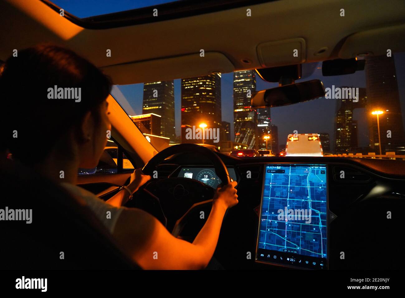 Driving at night young woman Stock Photo - Alamy