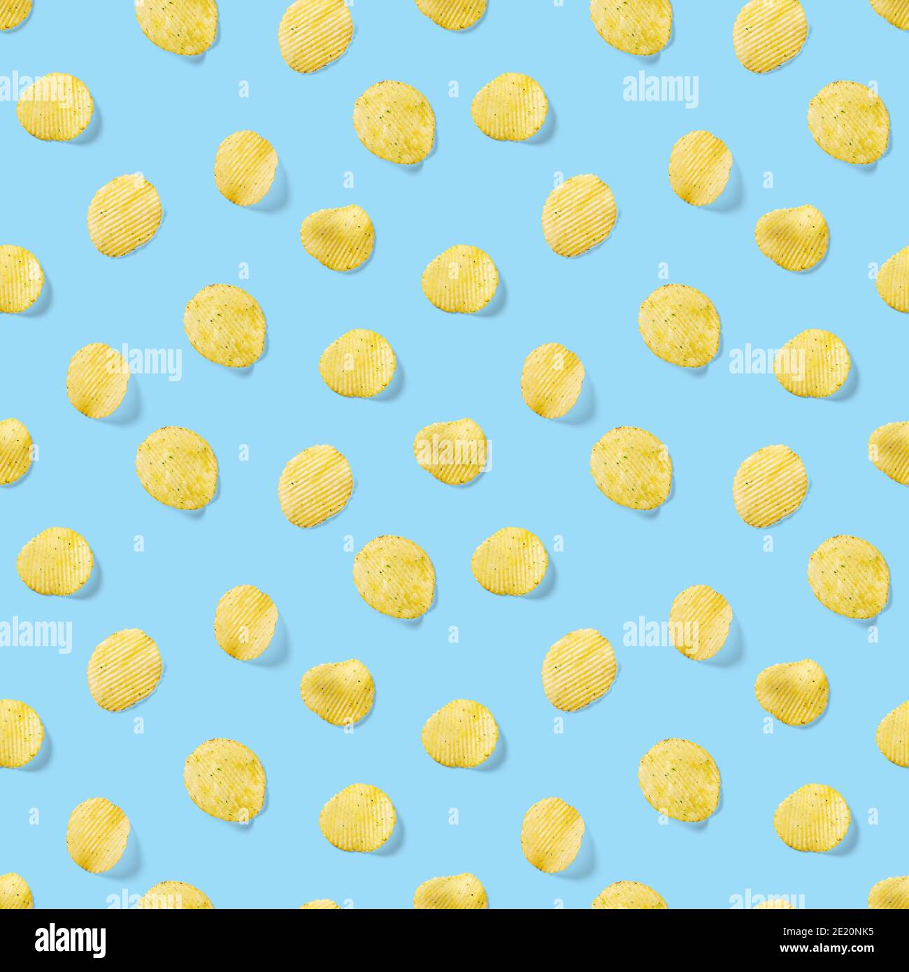 Seamless pattern made from Potato chips on light blue background flat ...