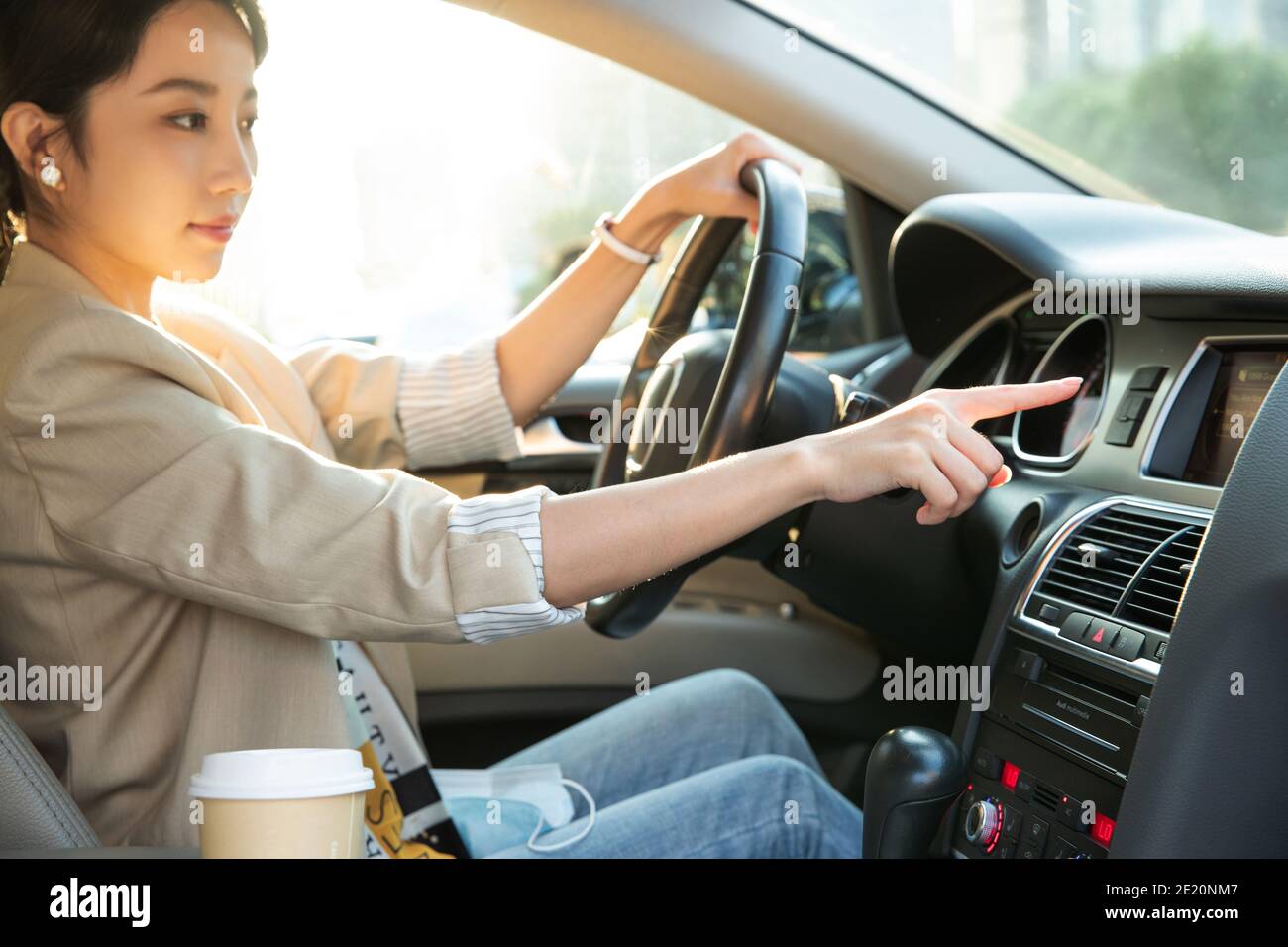The young woman driving Stock Photo - Alamy
