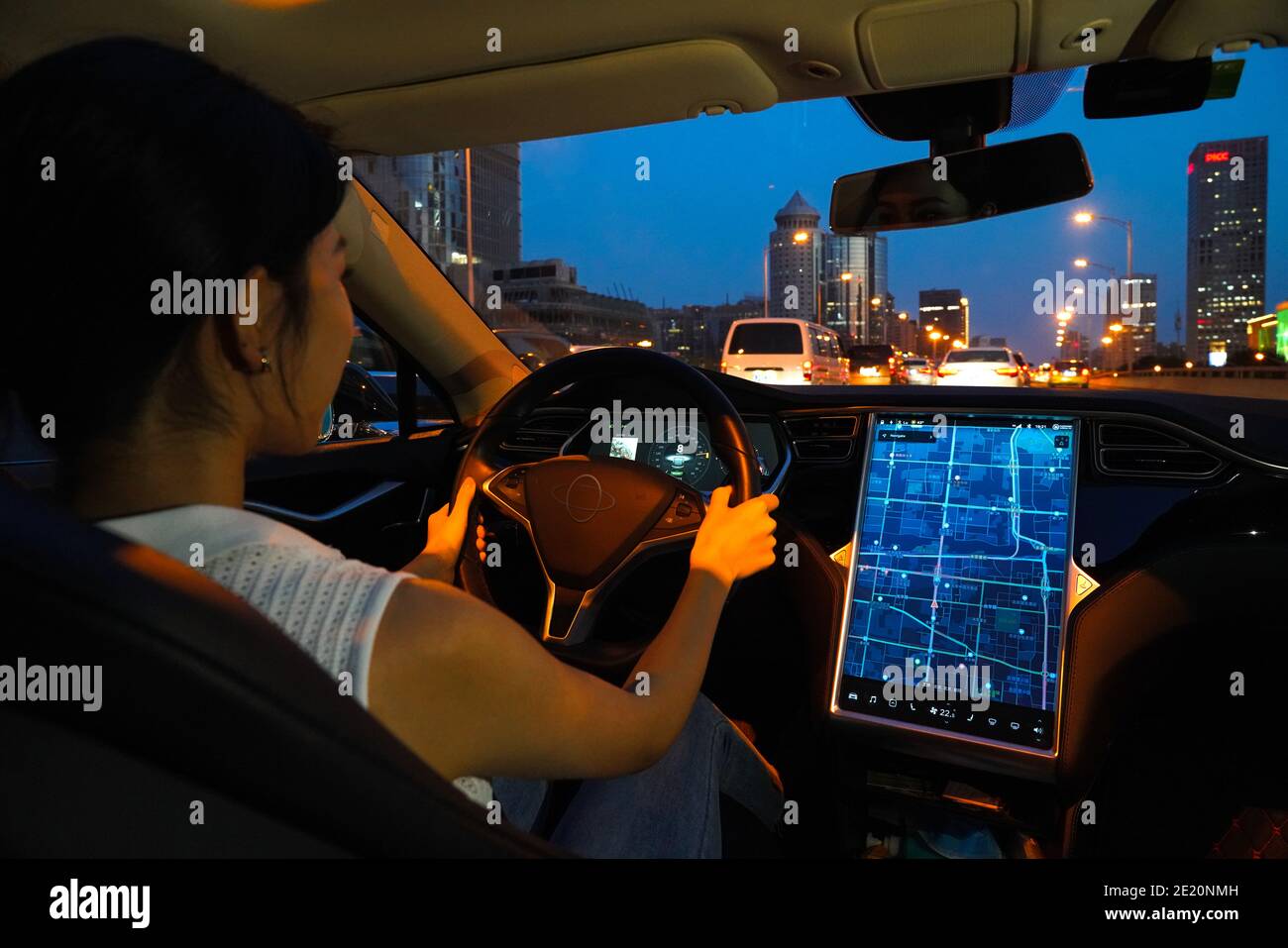 Driving at night young woman Stock Photo - Alamy