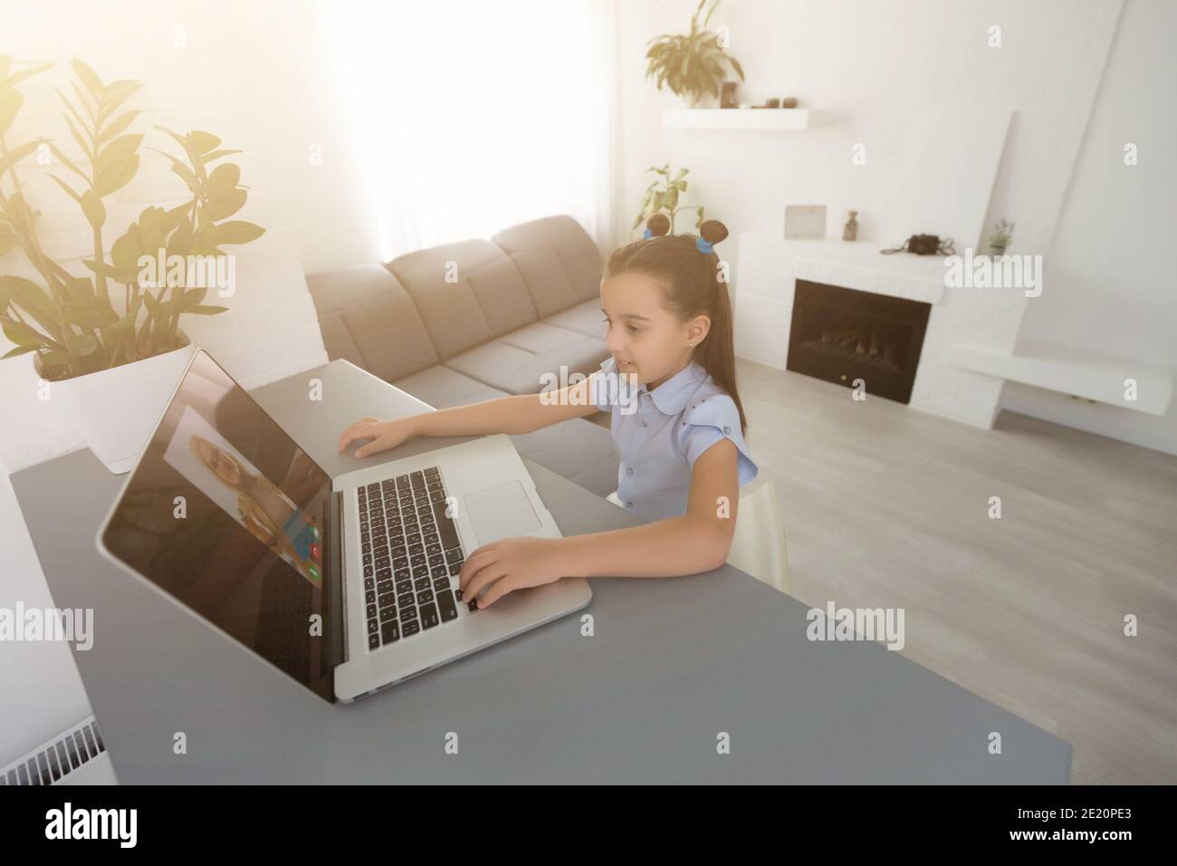 little girl studying with laptop online learning Stock Photo - Alamy