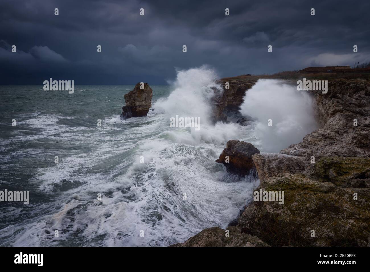 Dramatic nature background - big waves and dark rock in stormy sea ...