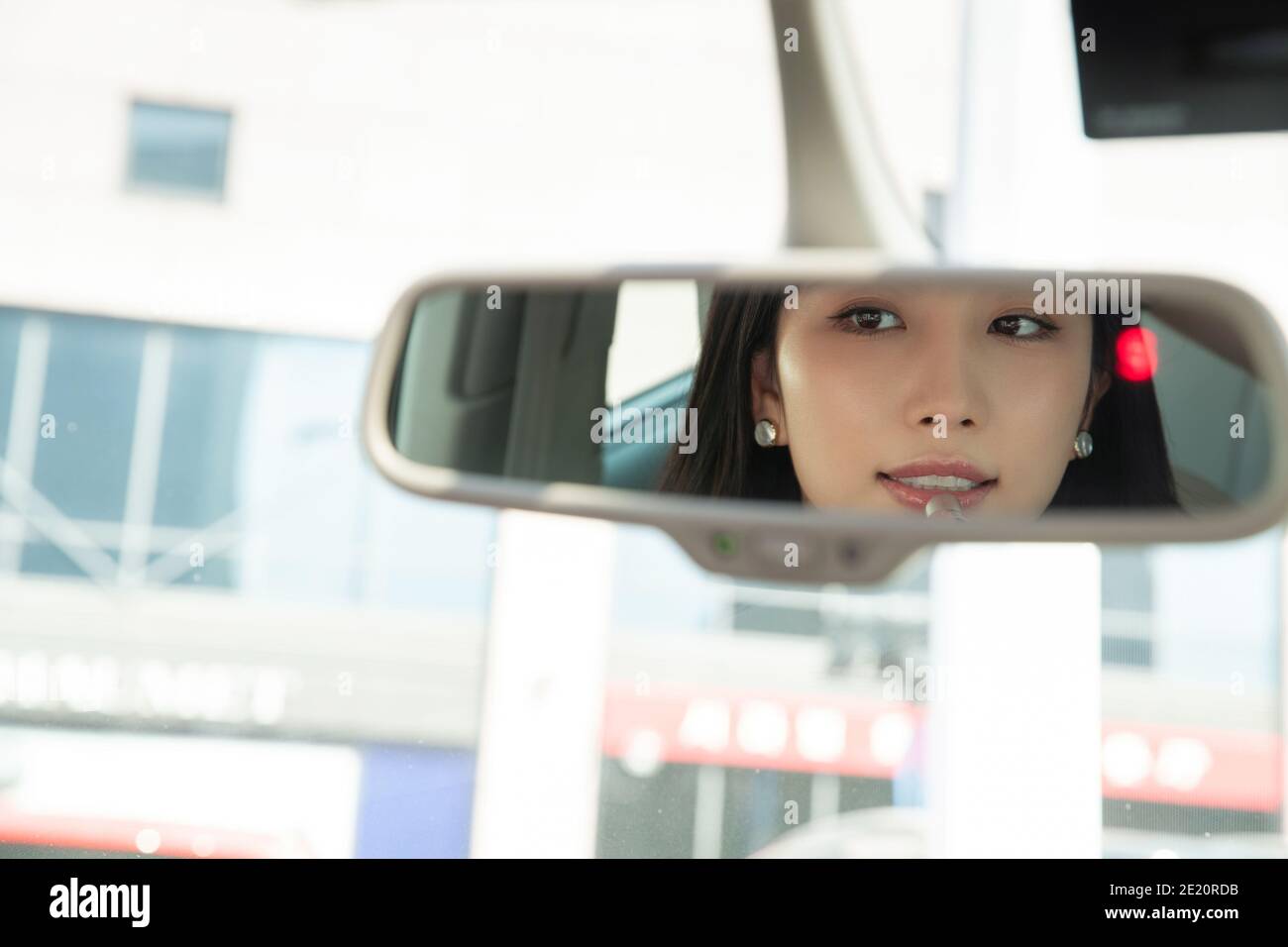 Auto rearview mirror of young women wear makeup Stock Photo - Alamy