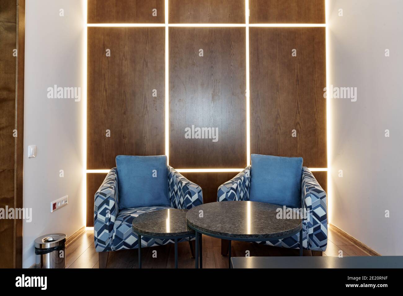Office waiting area with arm chairs and coffee table Stock Photo - Alamy