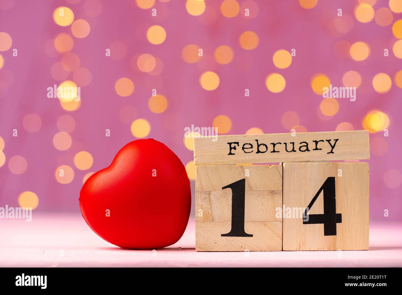 Wooden calendar 14th of February on pink bokeh background Stock Photo ...
