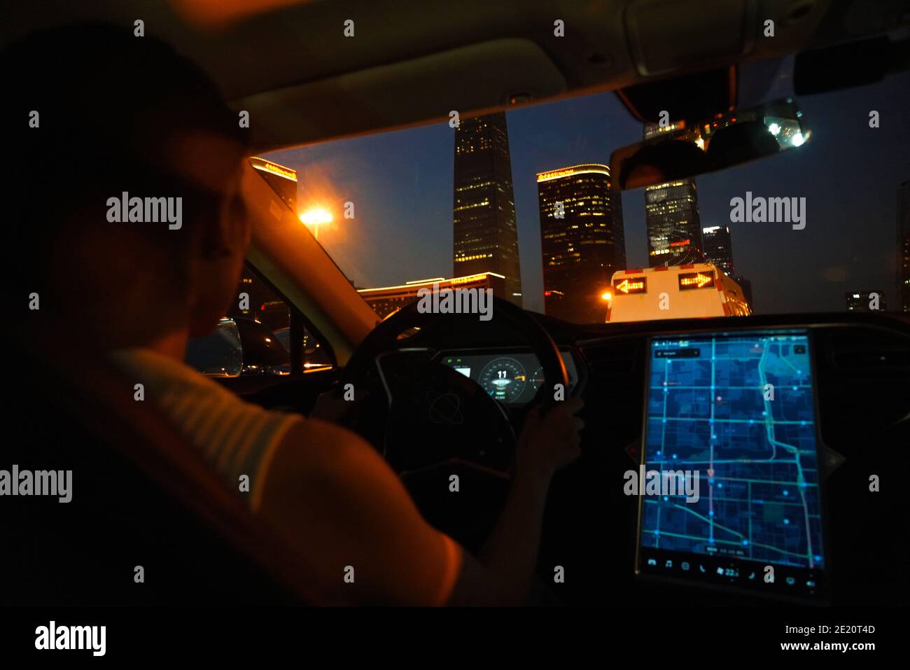 Driving at night young woman Stock Photo - Alamy