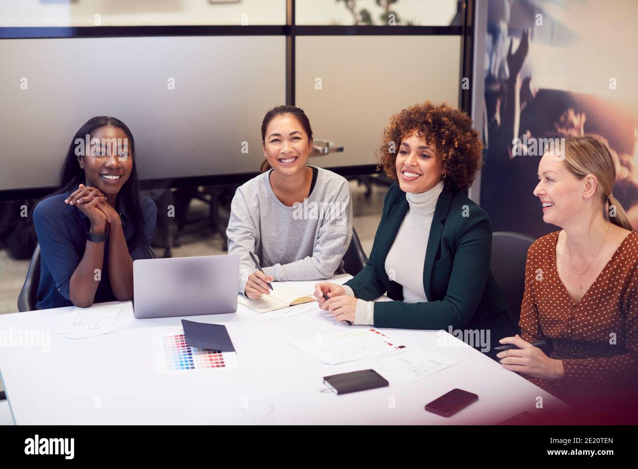 Group Of Businesswomen Collaborating In Creative Meeting Around Table ...