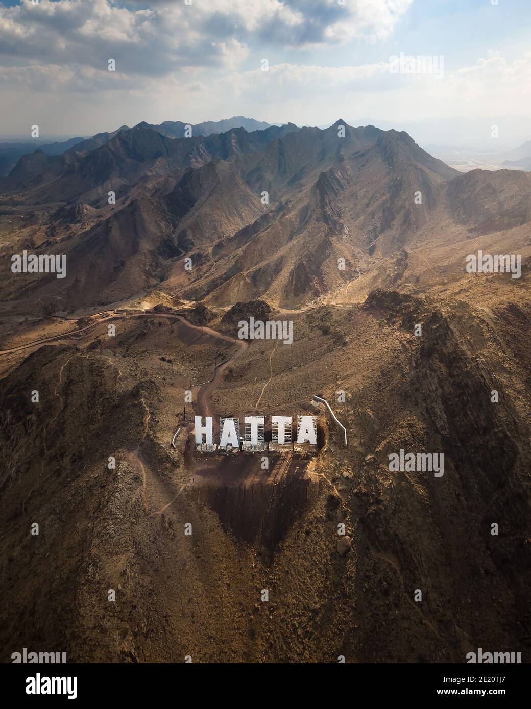 Hatta city welcoming sign written with large letters placed in Hajar ...