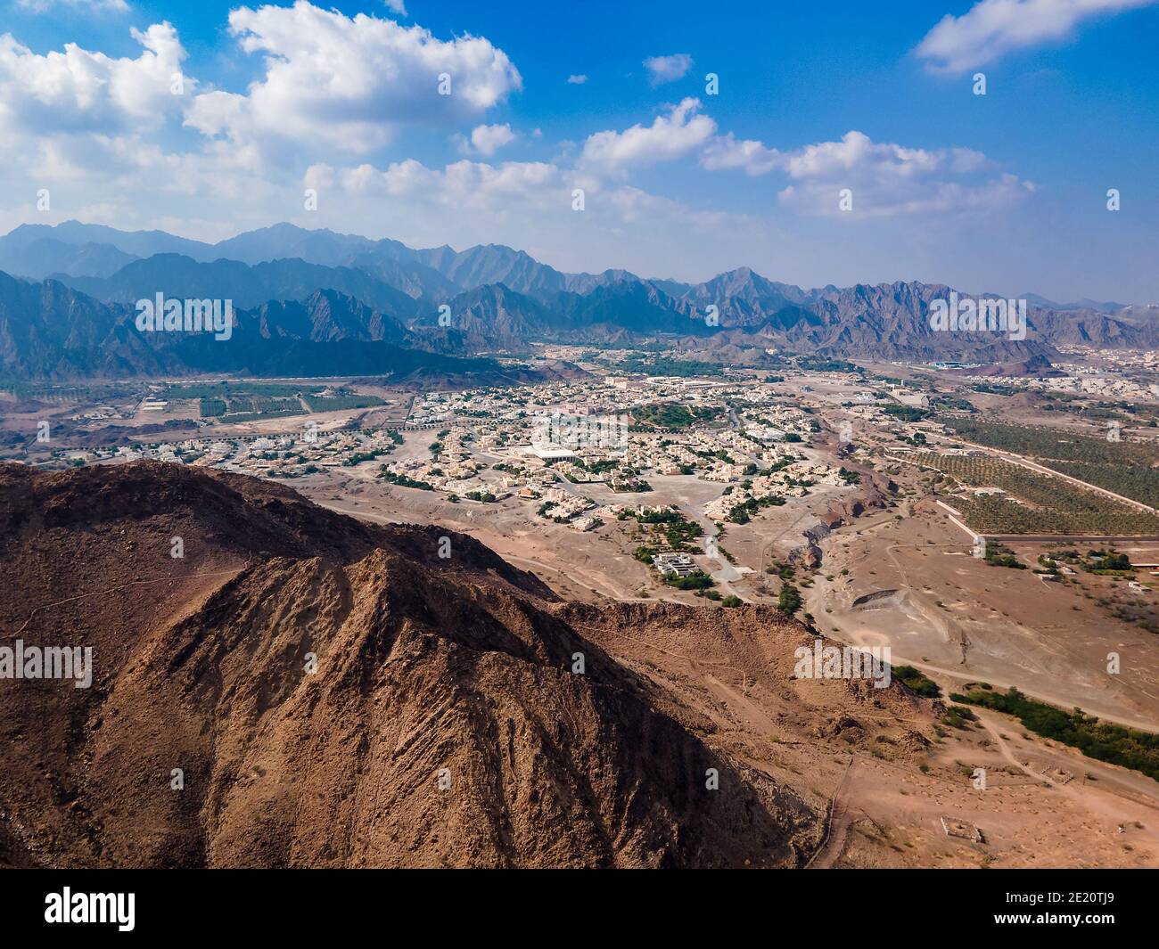 Hatta town aerial cityscape surrounded by Hajar mountains in Hatta ...