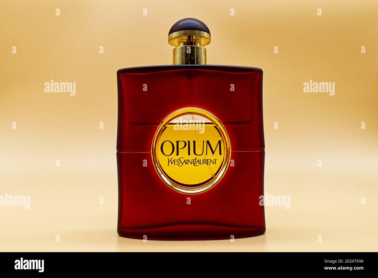 Opium from Yves Saint Laurent perfume on golden background Stock Photo ...