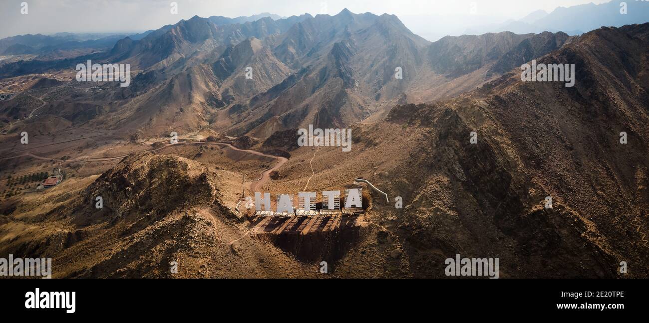 Hatta city welcoming sign written with large letters placed in Hajar ...