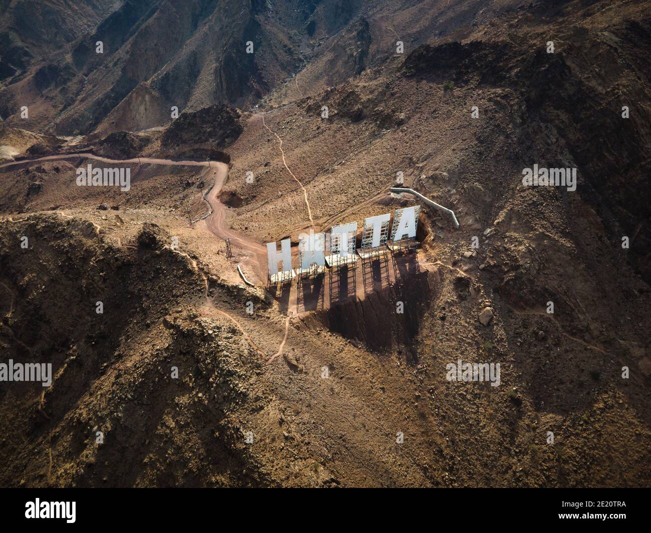 Hatta city welcoming sign written with large letters placed in Hajar ...