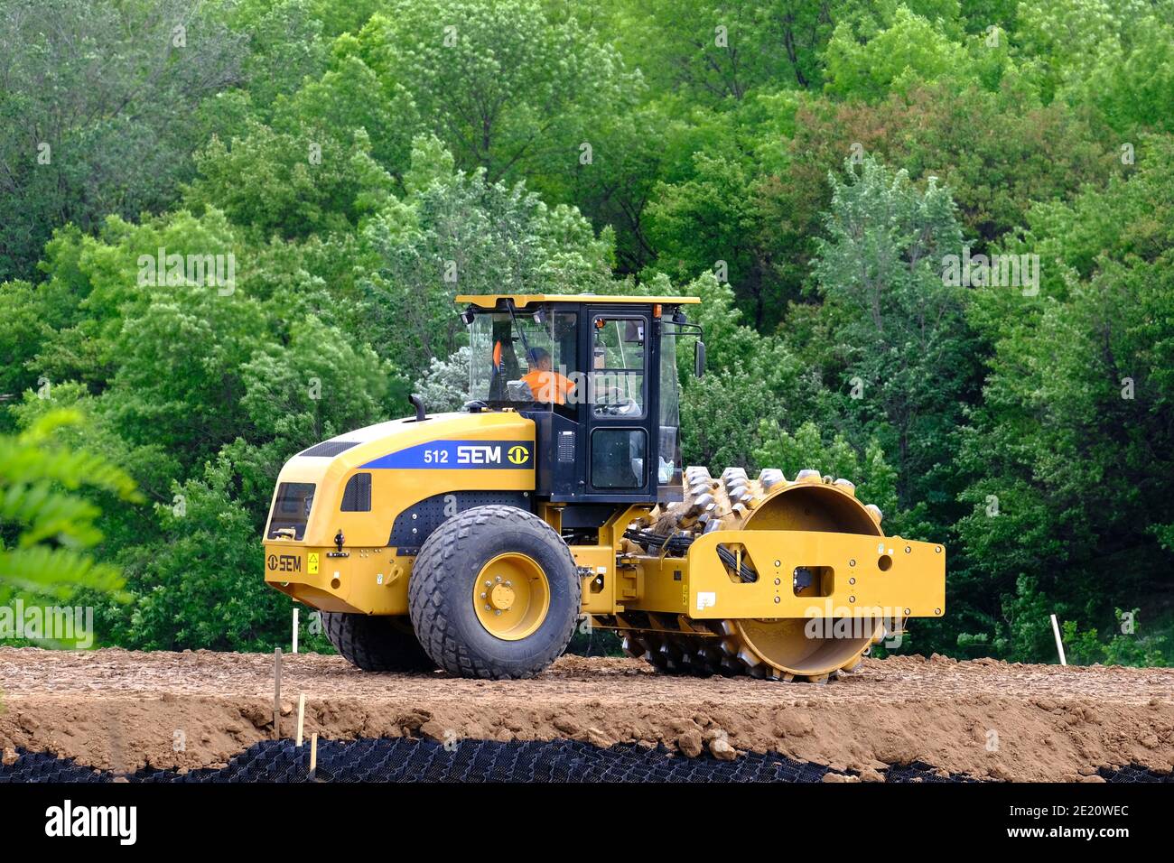 KRYVYI RIH, UKRAINE - MAY, 2020. Road Roller, Soil Skating Rink Making ...