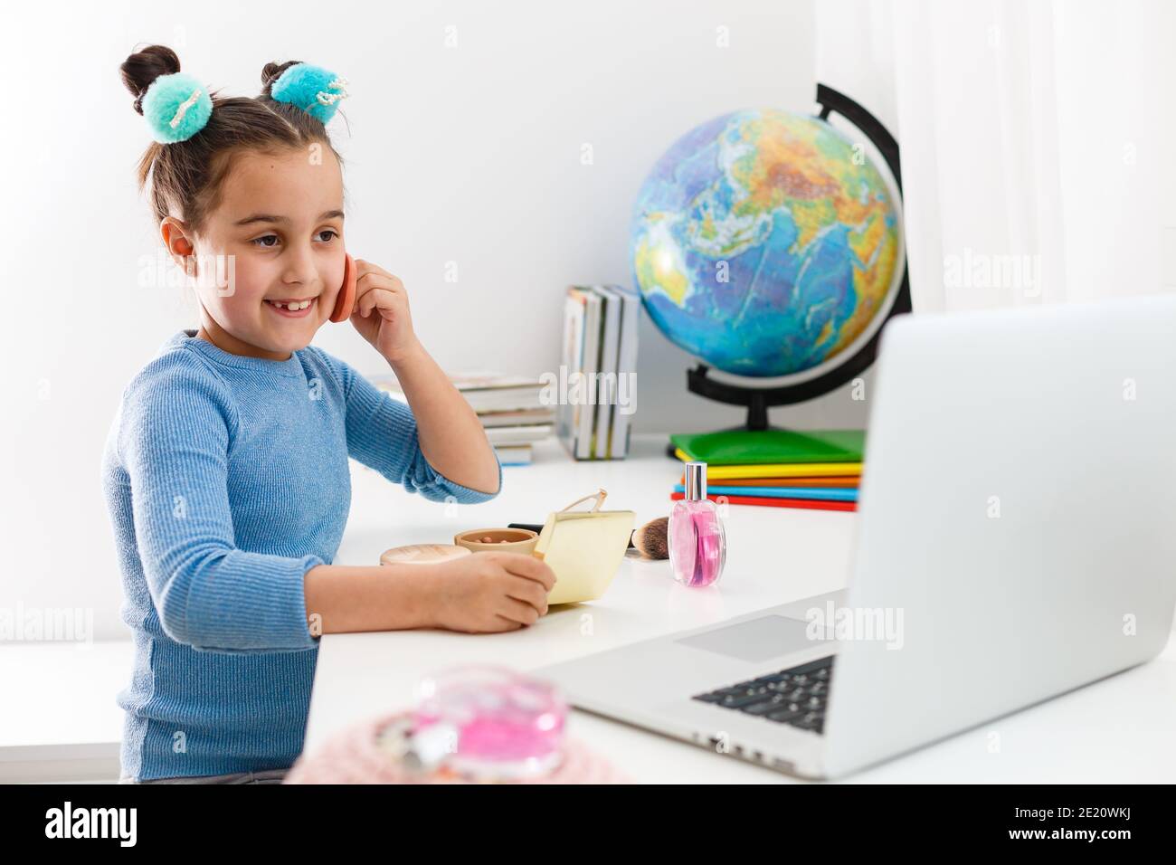 lessons of makeup on the computer girl looks and wants to repeat the ...