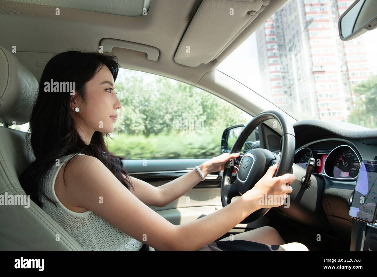 A beautiful young woman driving Stock Photo - Alamy