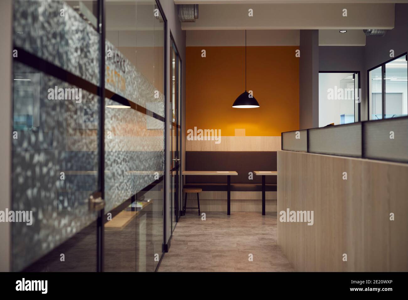 View Along Corridor Of Modern Office To Informal Seating Area Stock ...