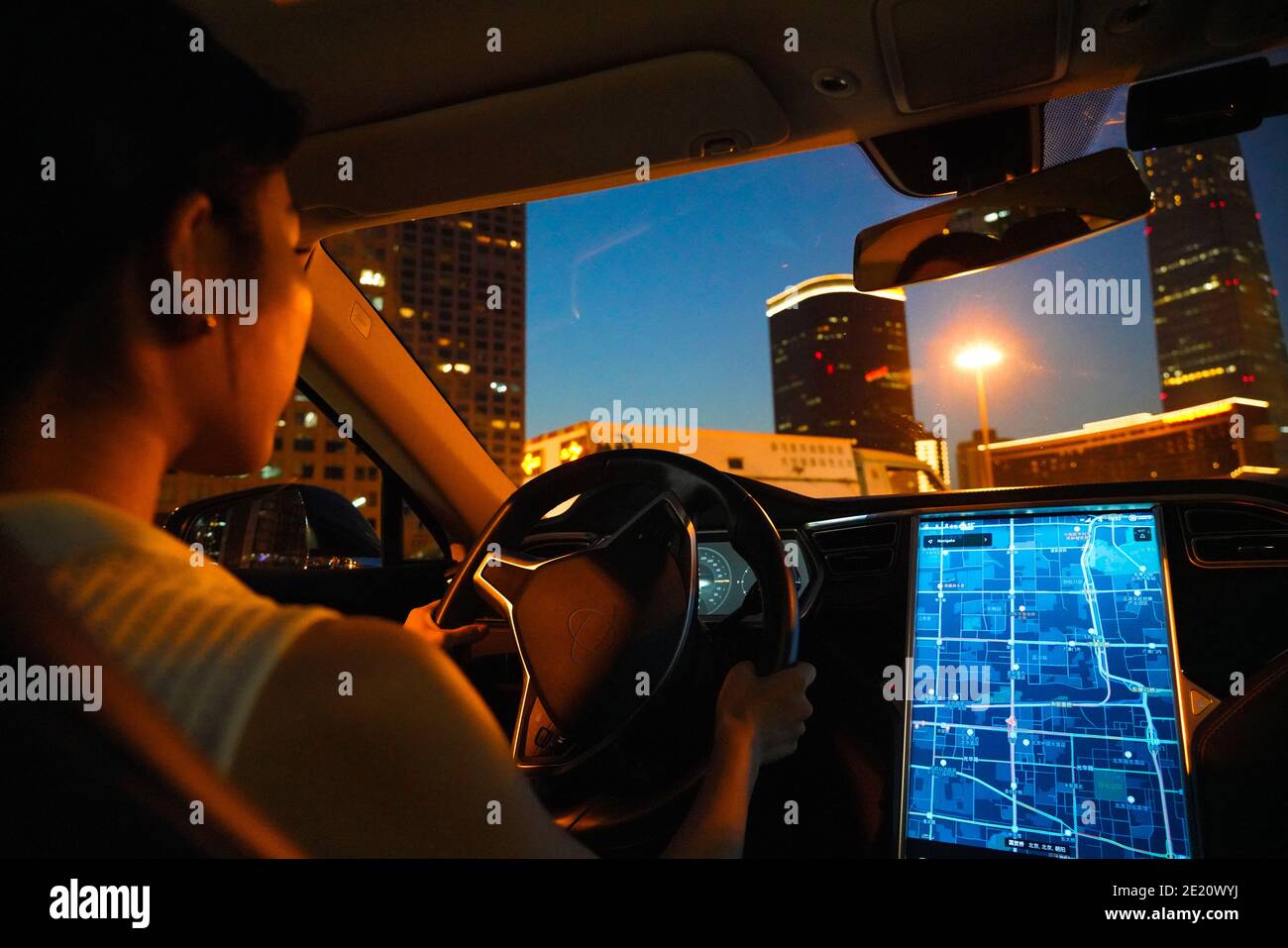 Driving at night young woman Stock Photo - Alamy