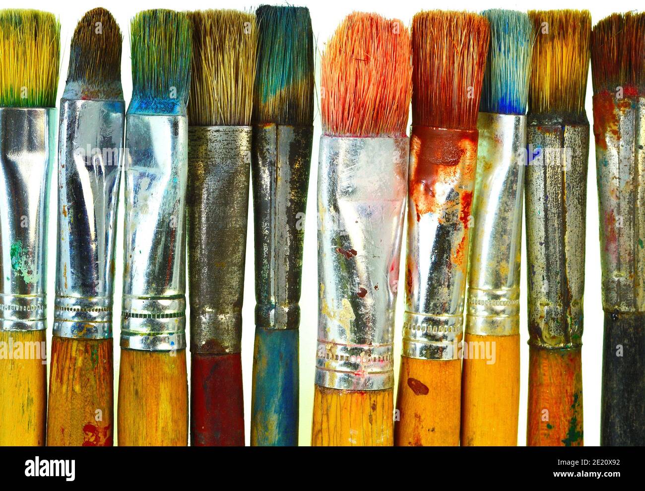 Various dirty paint brushes. Paints and brushes isolated on white ...