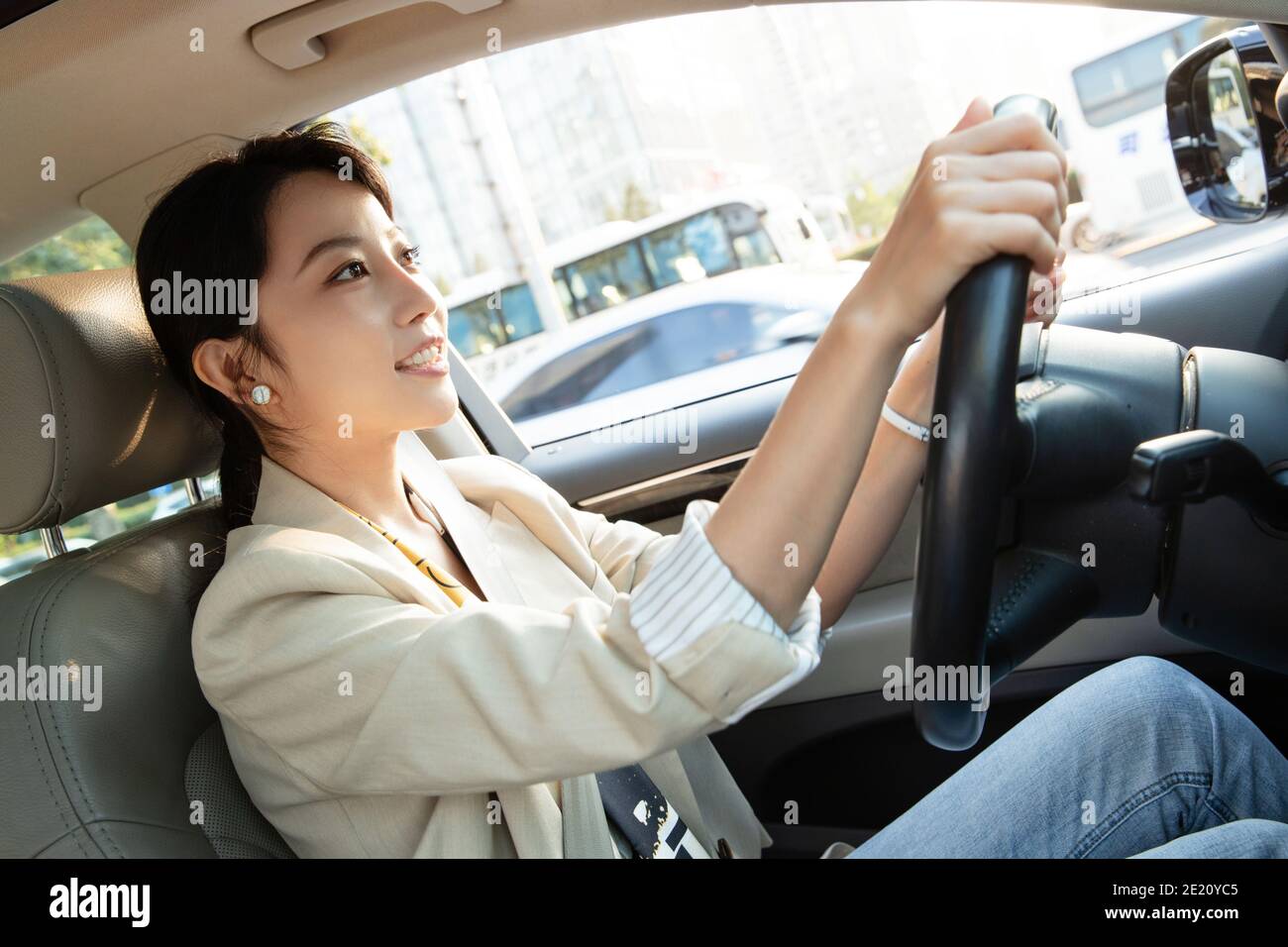 The fashionable young woman driving Stock Photo - Alamy