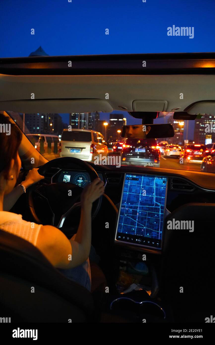 Rush hour driving young woman Stock Photo - Alamy