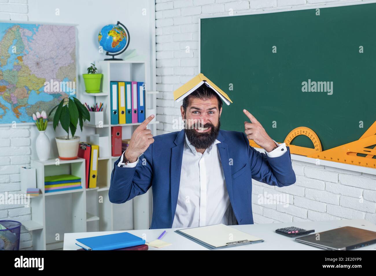 confused man with beard overworked with notebook. troubles in studying ...