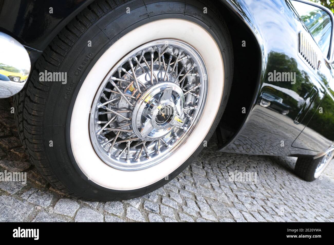 Wheel of black vintage classic luxury car close up on exhibition Stock ...