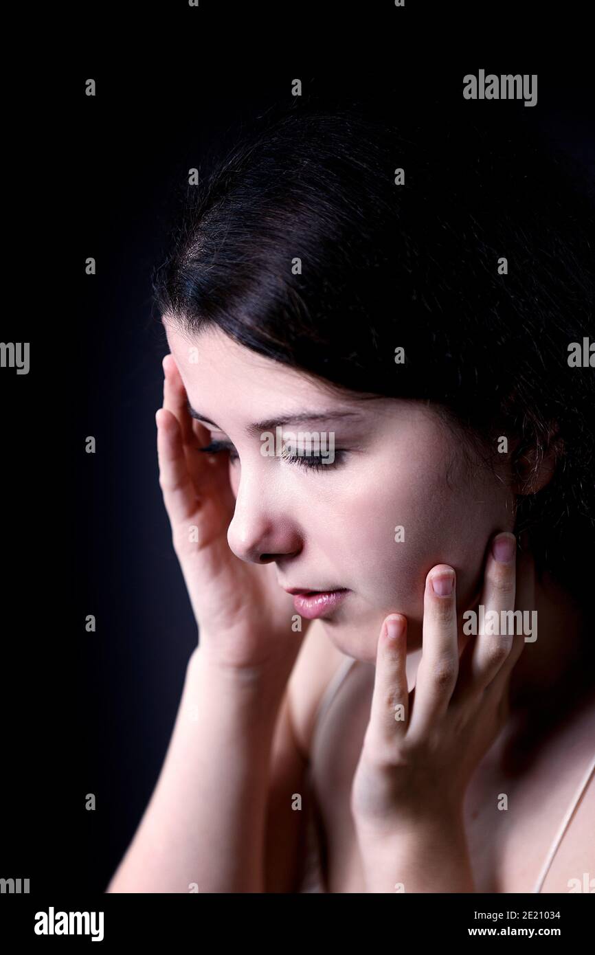 young woman in sad attitude III Stock Photo - Alamy