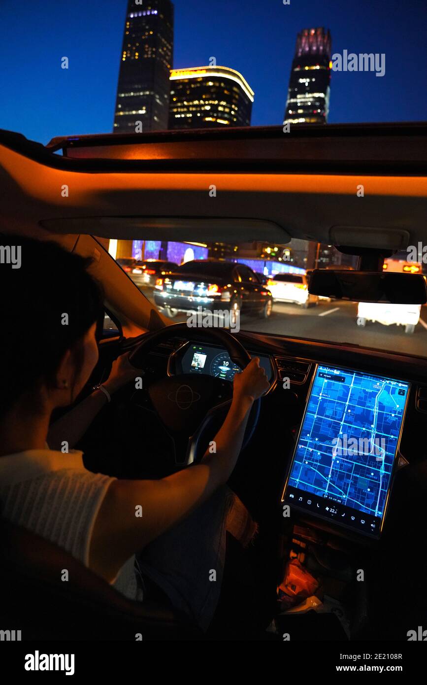 Driving at night young woman Stock Photo - Alamy