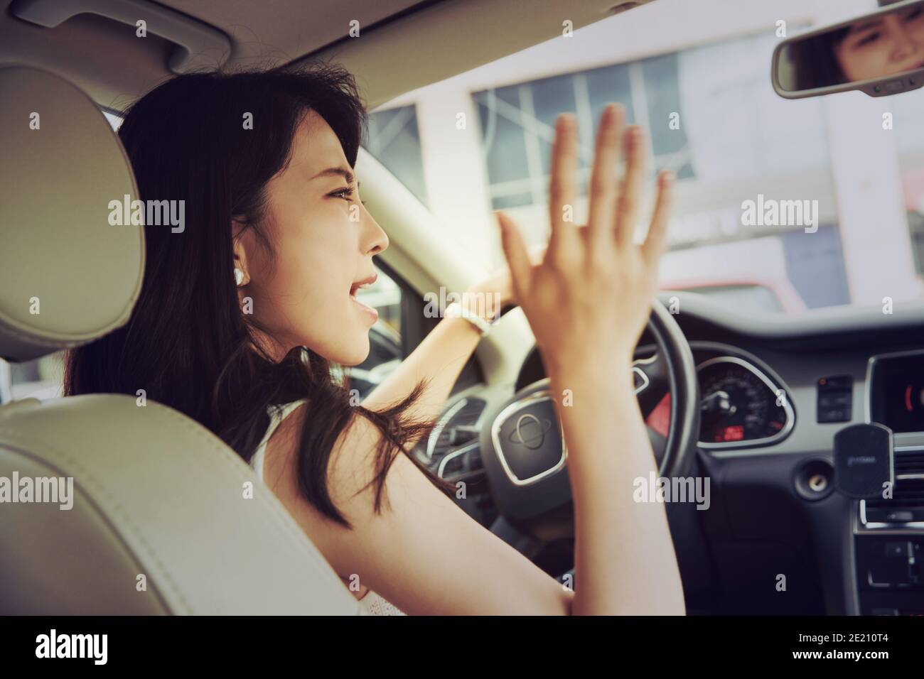 Driving an angry young woman Stock Photo - Alamy