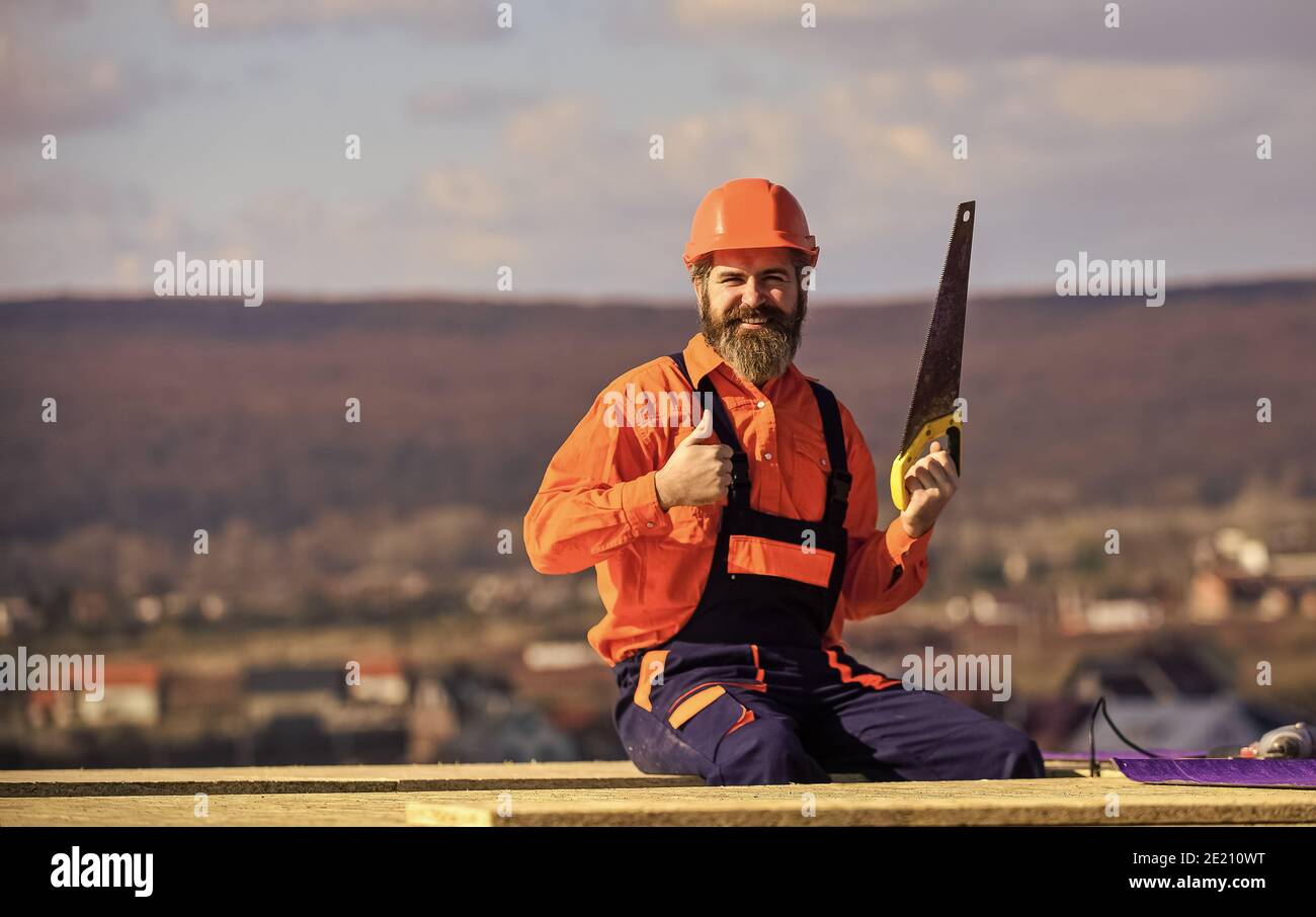 Construction carpentry. Man builder wear uniform and hard hat for ...