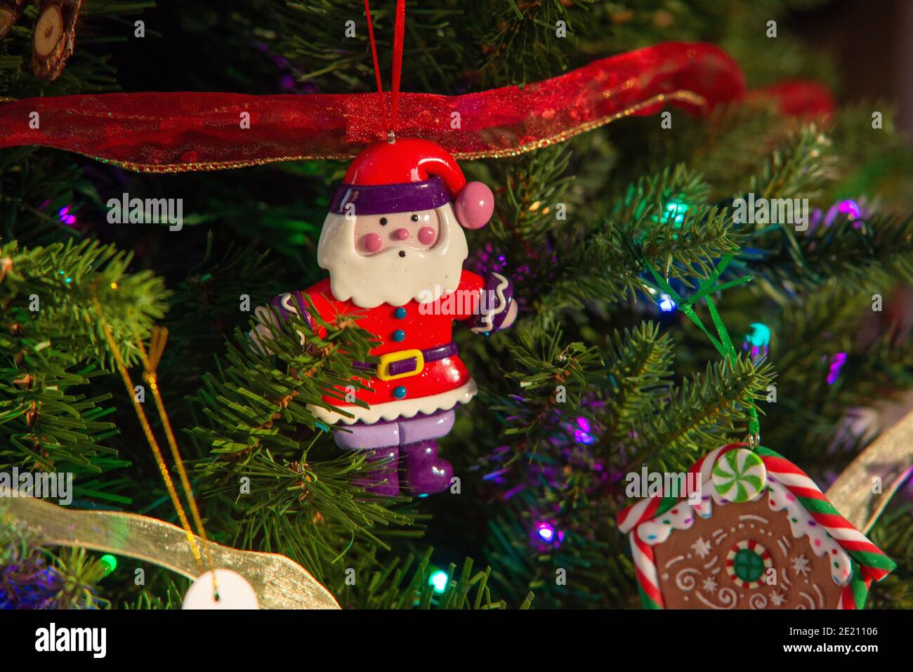 Santa Claus decoration on Christmas tree Stock Photo - Alamy