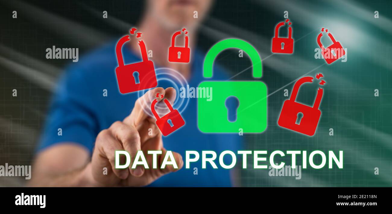 Man touching a data protection concept on a touch screen with his ...