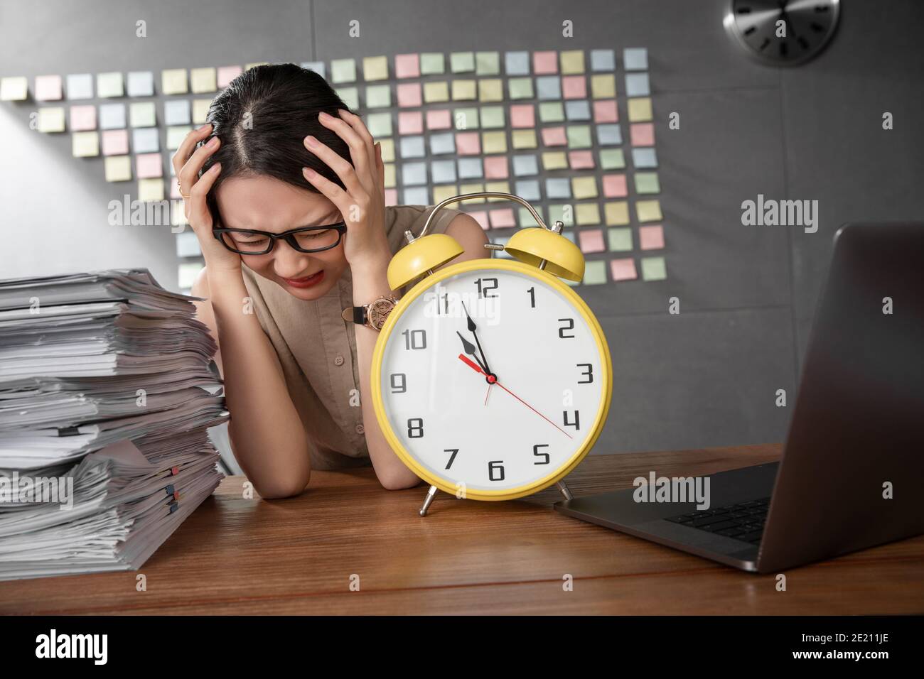 Tired businesswoman alarm clock hi-res stock photography and images - Alamy